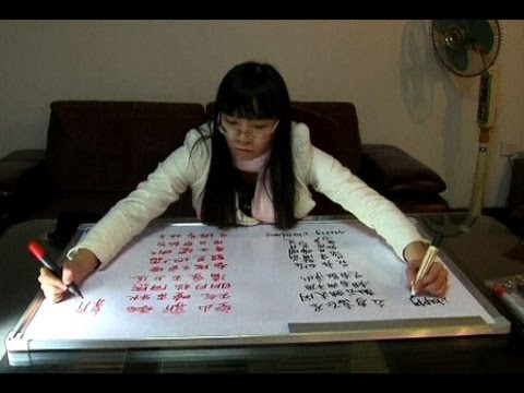 Woman Can Write With Both Hands Simultaneously, In Different Languages