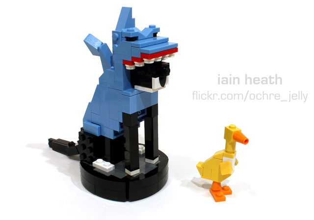 LEGO Model of the Cat in a Shark Costume Riding a Roomba Vacuum Chasing ...