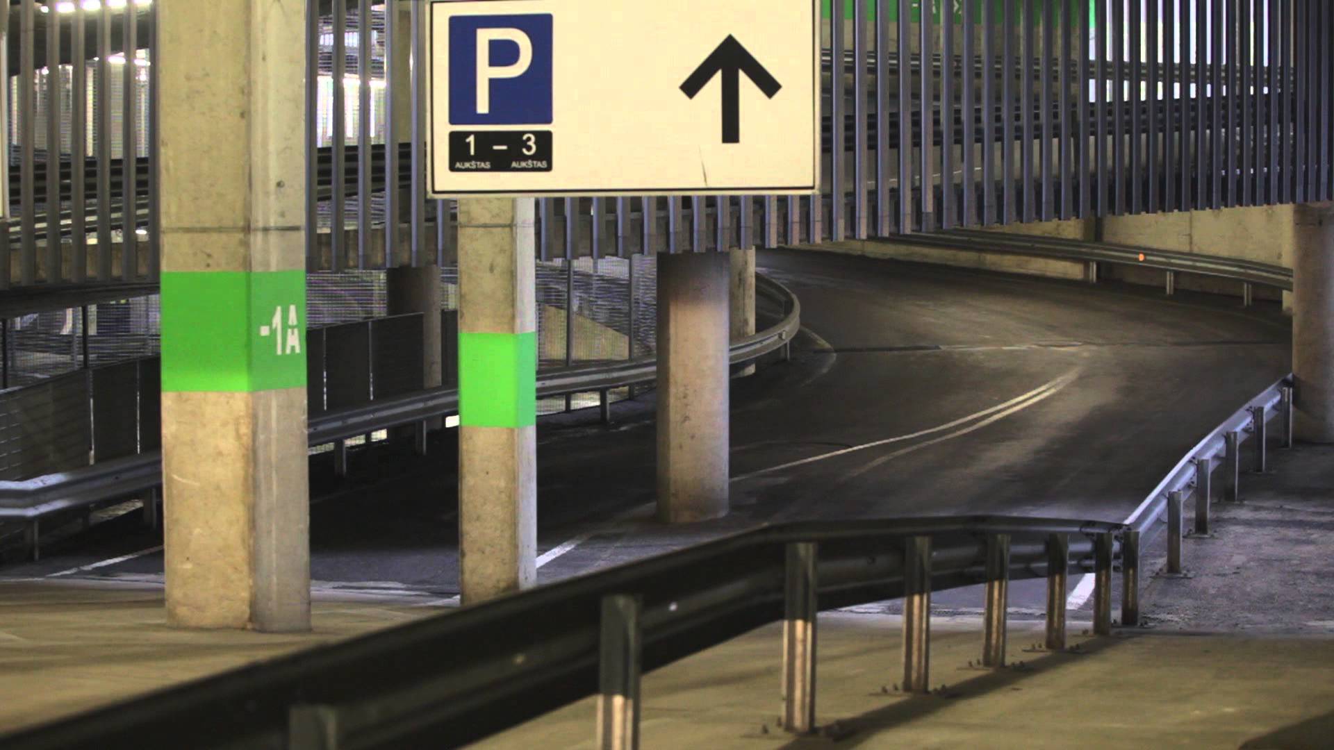 Driver Drifts a BMW Up the Ramp of a Parking Garage