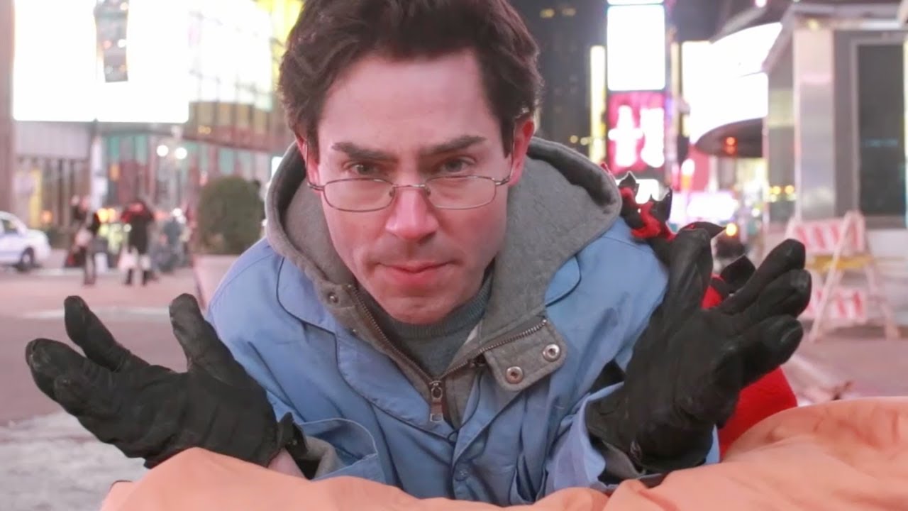Mark Malkoff Tries to Fall Asleep in Times Square While Being Carried ...