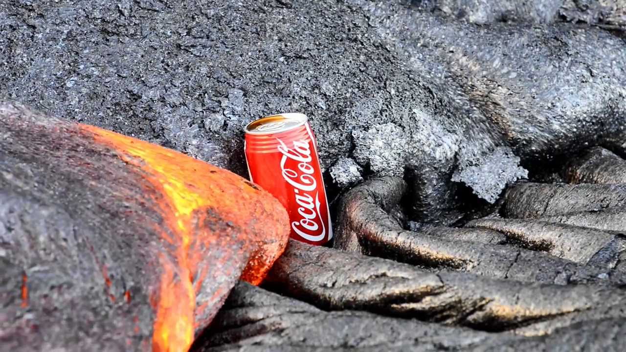 Two Coke Cans Getting Slowly Devoured by Lava