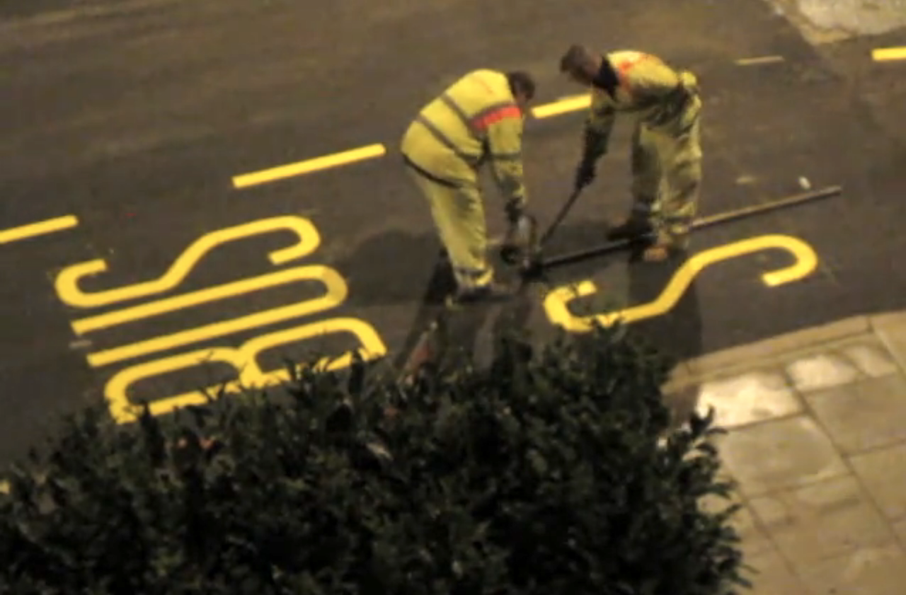 A Timelapse of Two Street Workers Expertly Painting the Letters For a ...
