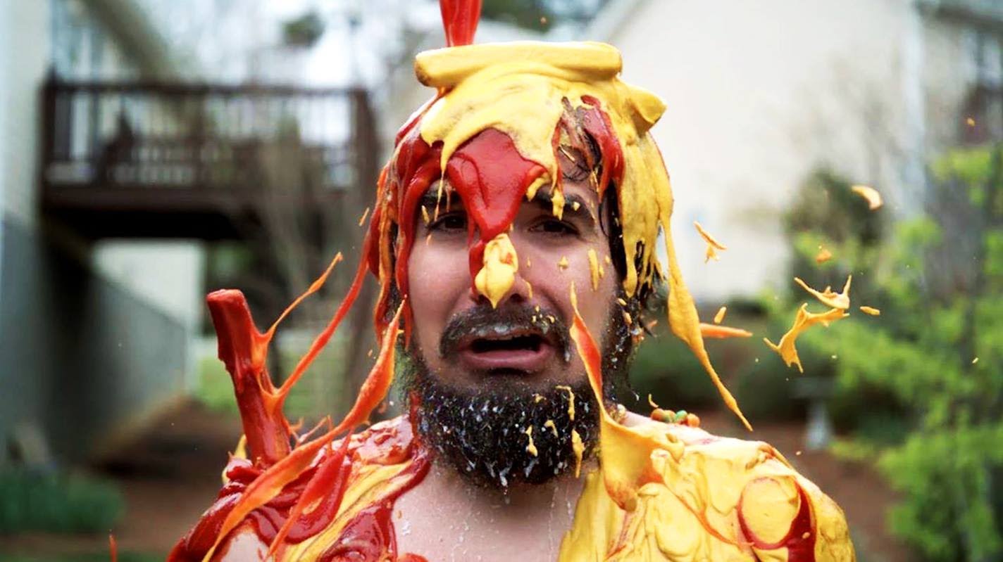 A Variety of Food Slowly Rains Down Upon Two Men