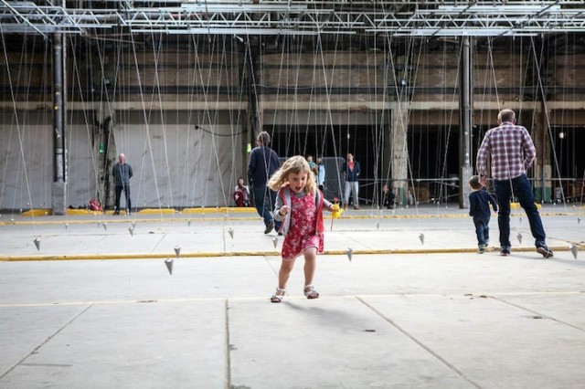An Interactive Swinging Pendulum Installation That Encourages Participants to Dance