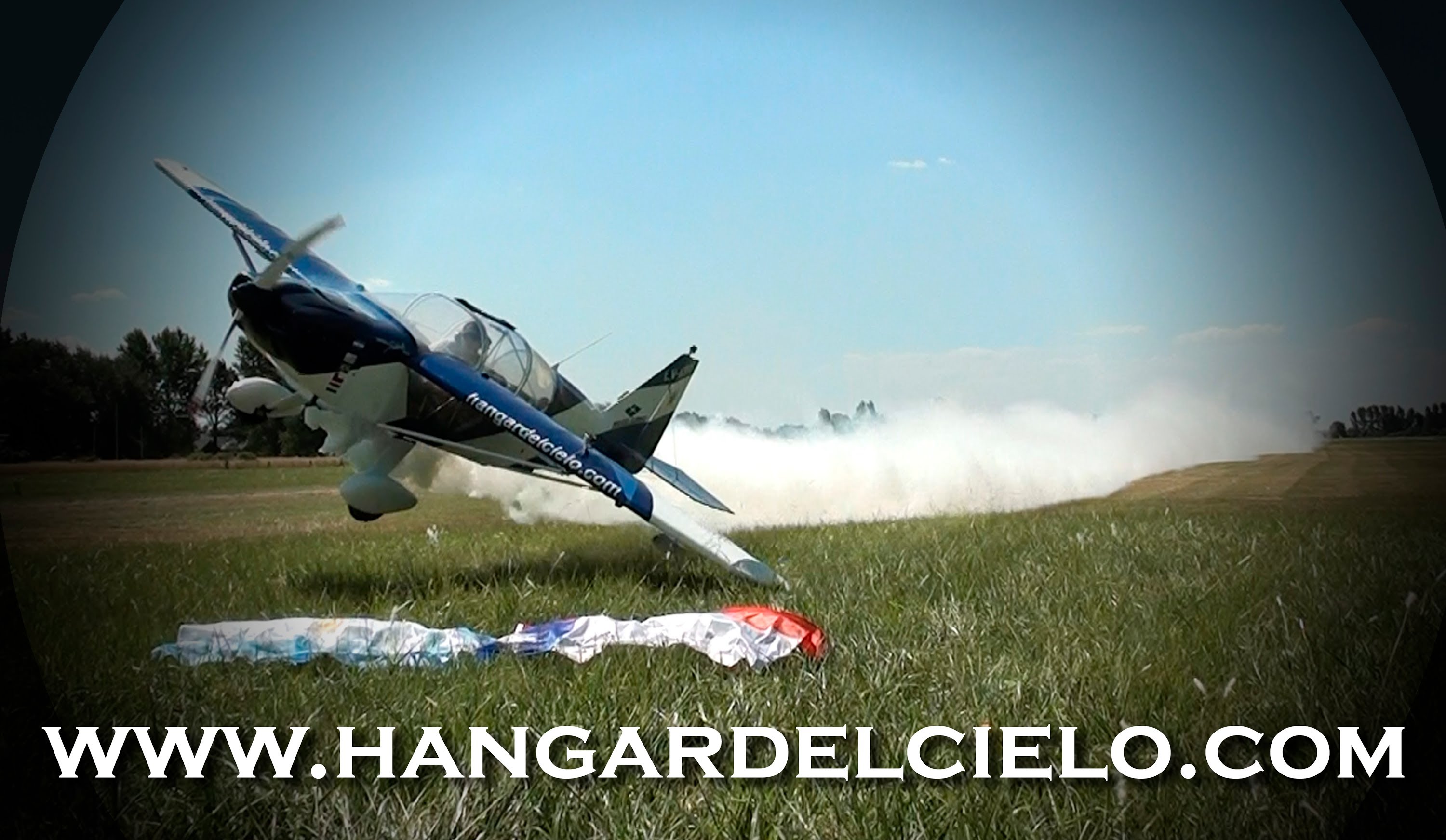 Low-Flying Pilot Uses Propeller Plane Wing to Pick Up Flags Off the ...