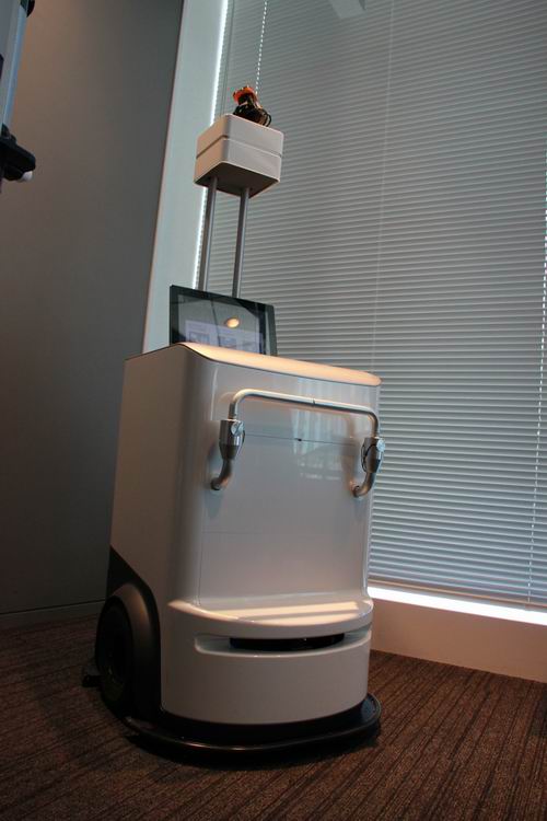 A Robotic Printer With Wheels That Can Travel To People Delivering ...