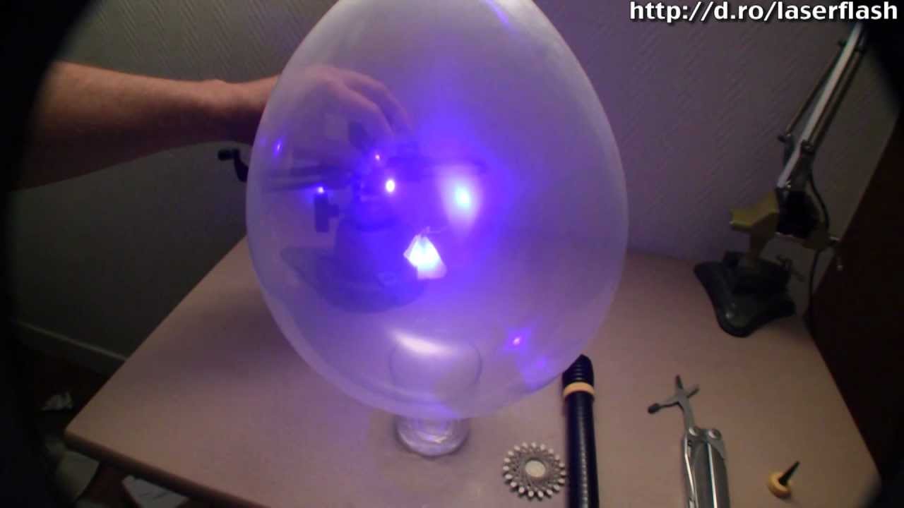 A Laser Igniting Flash Paper Inside of a Balloon