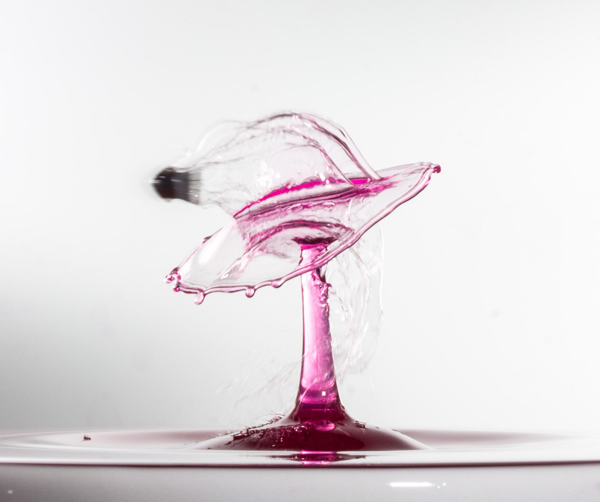 How to Capture High-Speed Photographs of Bullets Piercing Water Droplets