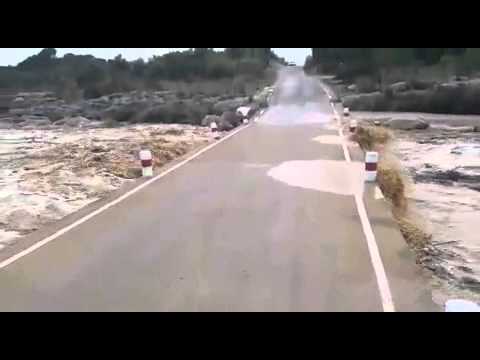 A Dry Stream Bed Instantly Becomes a Raging River, Overtaking a Bridge ...