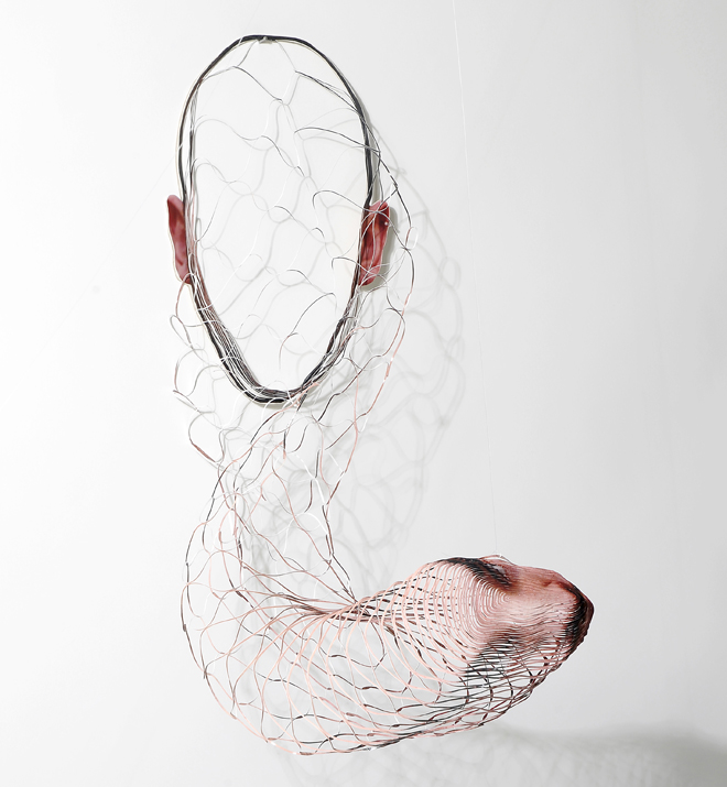 Wonderfully Distorted Sculptures Created From Cut Portrait Photos