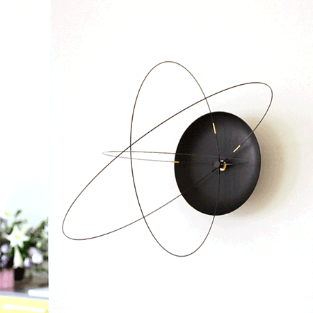 The Orbits Clock, A Wall Clock With Rotating Carbon Fiber Circles for Hands