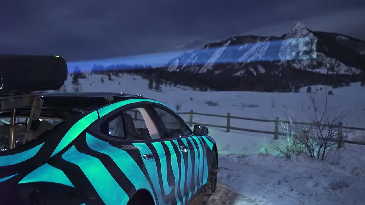 A Projector-Equipped Tesla Model S Beams Messages of Sustainability ...