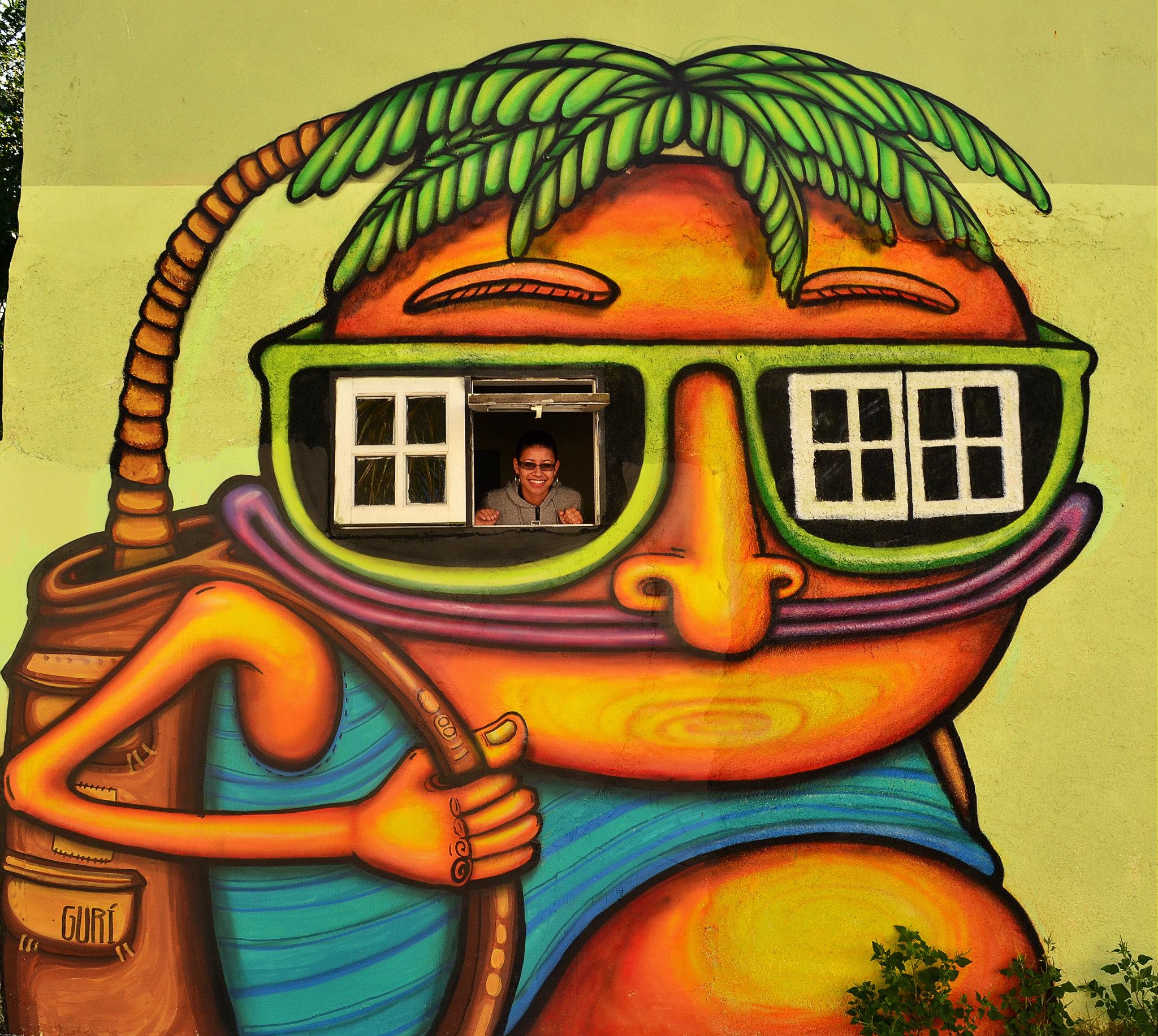 Playful Character Street Art by Guri