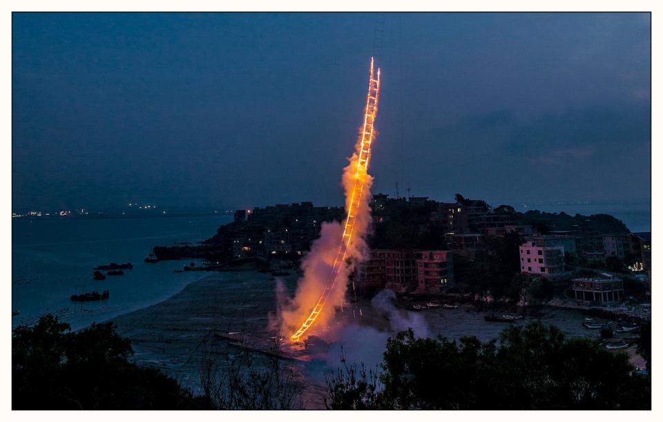 A Burning Ladder of Pyrotechnics Reaches 500 Meters Into the Air Before ...