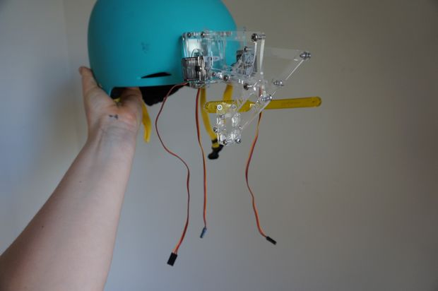 The Toothbrush Machine, A Motorized Helmet With a Robotic Toothbrush Arm