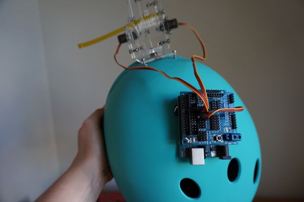 The Toothbrush Machine, A Motorized Helmet With a Robotic Toothbrush Arm