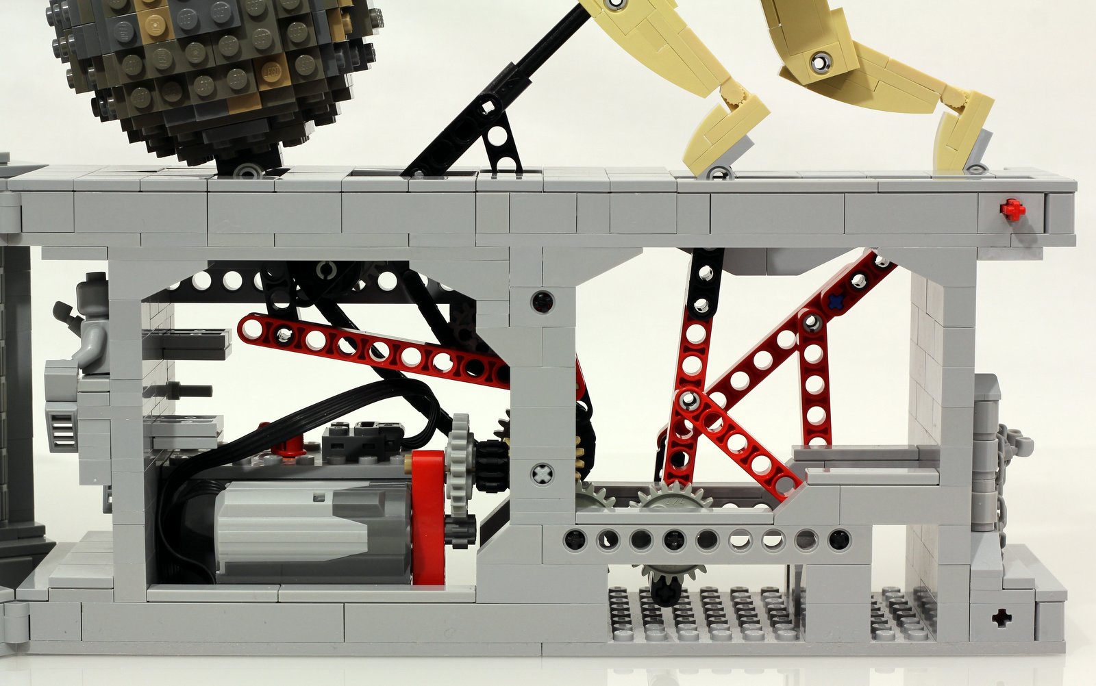A Kinetic LEGO Sculpture of Sisyphus Endlessly Pushing His Boulder Up a ...