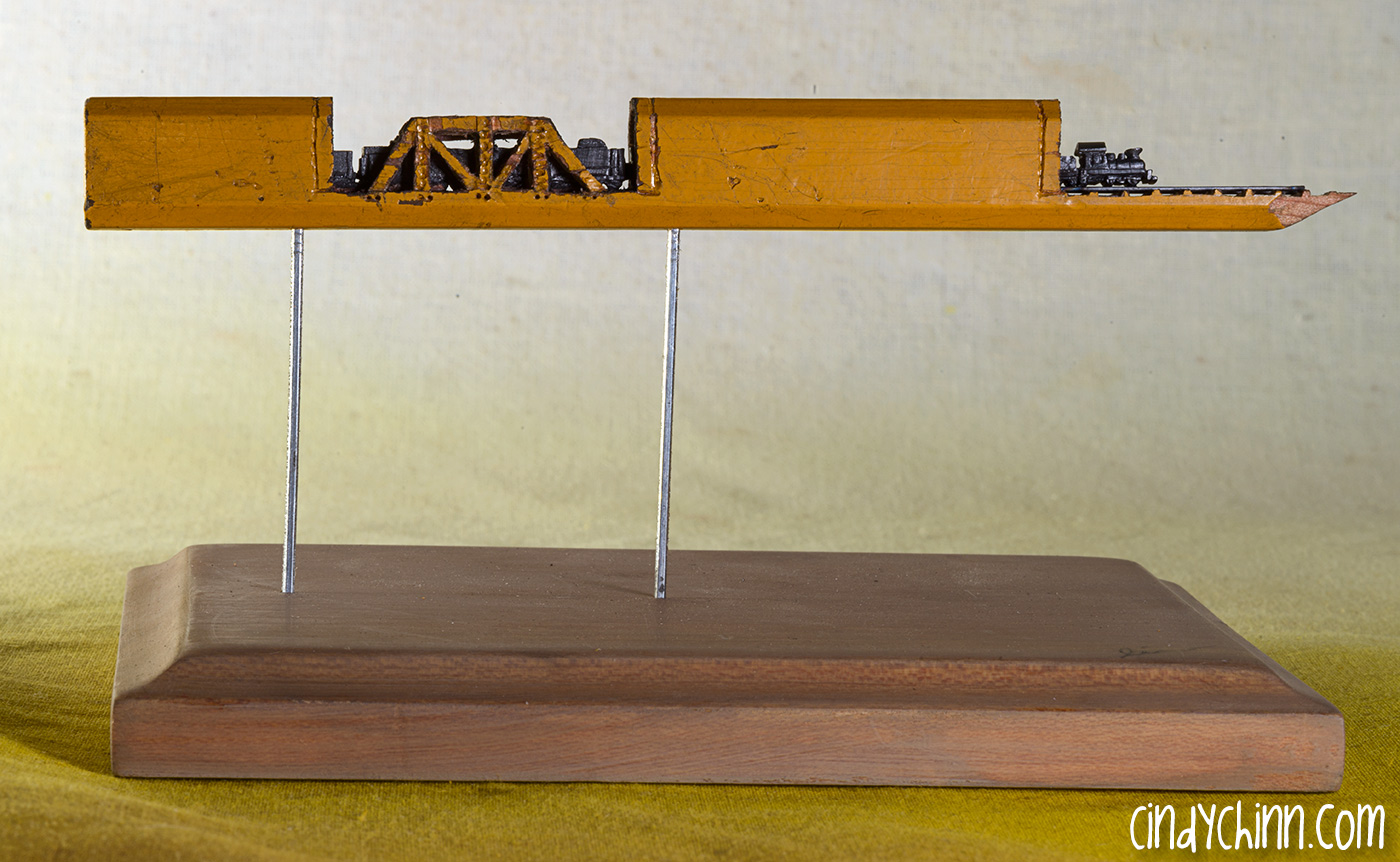 A Wonderfully Detailed Train and Trestle Expertly Carved Into the ...