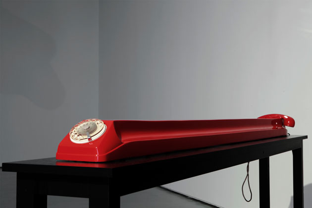 An Elongated Fully Functional Red Rotary Dial Phone That Takes Two ...