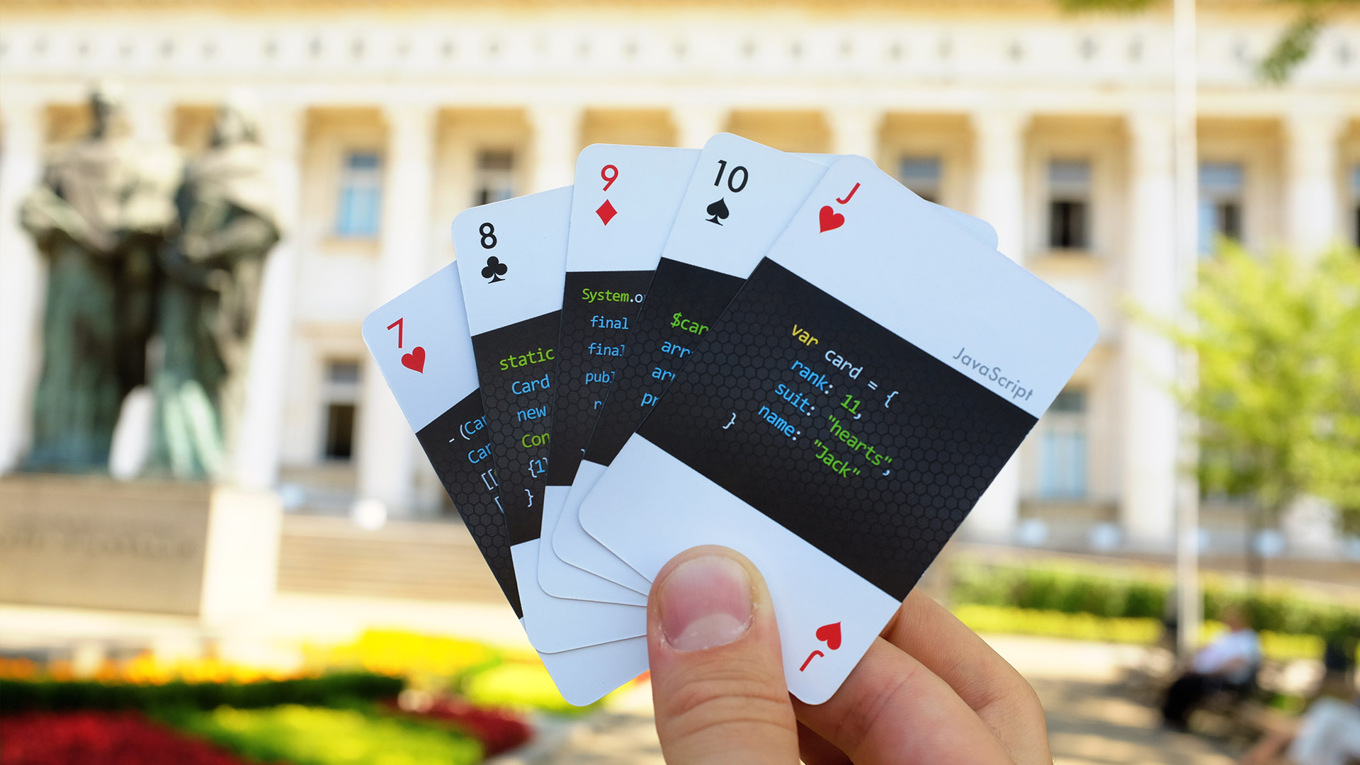 A Deck of Cards With Code Snippets Describing Each Card in Different Programming Languages