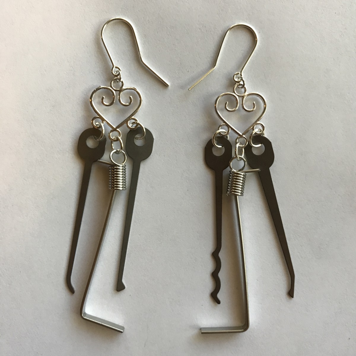 Cleverly Designed Silver Earrings That Hide a Handy Lock Pick Set In ...