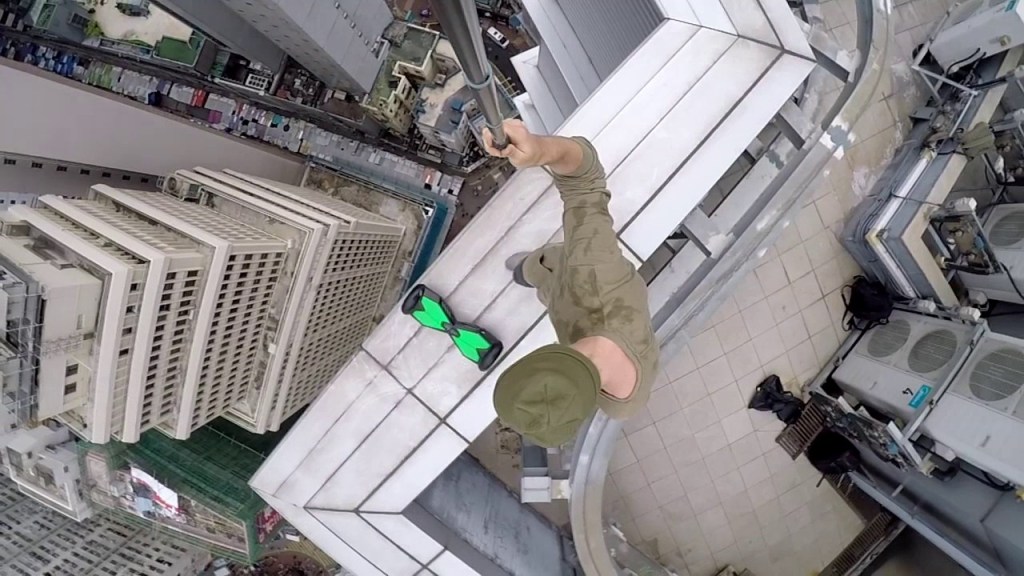 Daredevil Oleg Cricket Rides a Hoverboard on the Ledge of a High-Rise ...