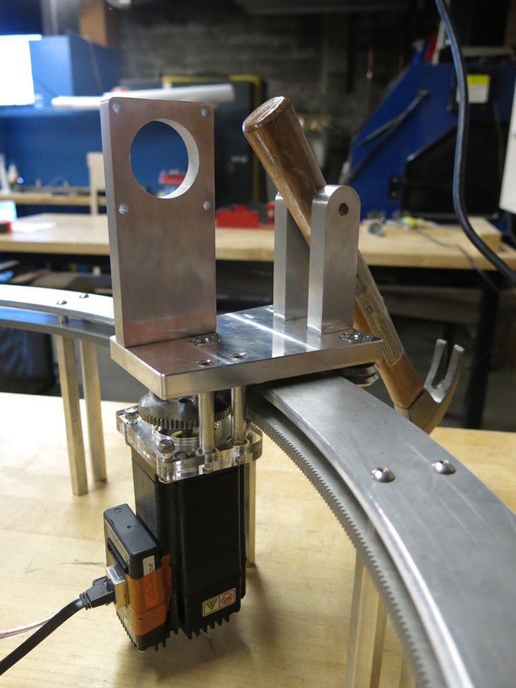 A Goldfish Controlled Hammer That Rotates Around a Semicircle Smashing ...