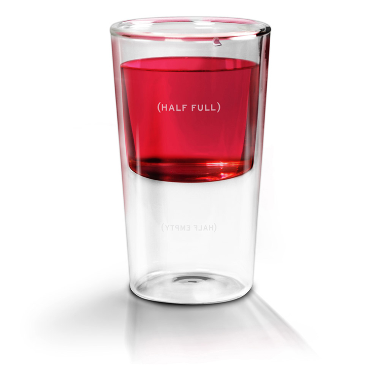 A Half Full Glass Featuring a Small Seven-Ounce Glass Within a Larger Glass