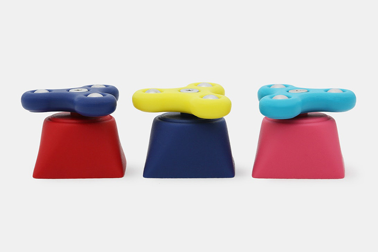 Colorful Custom Keyboard Keys With Tiny Fidget Spinners Mounted on Top