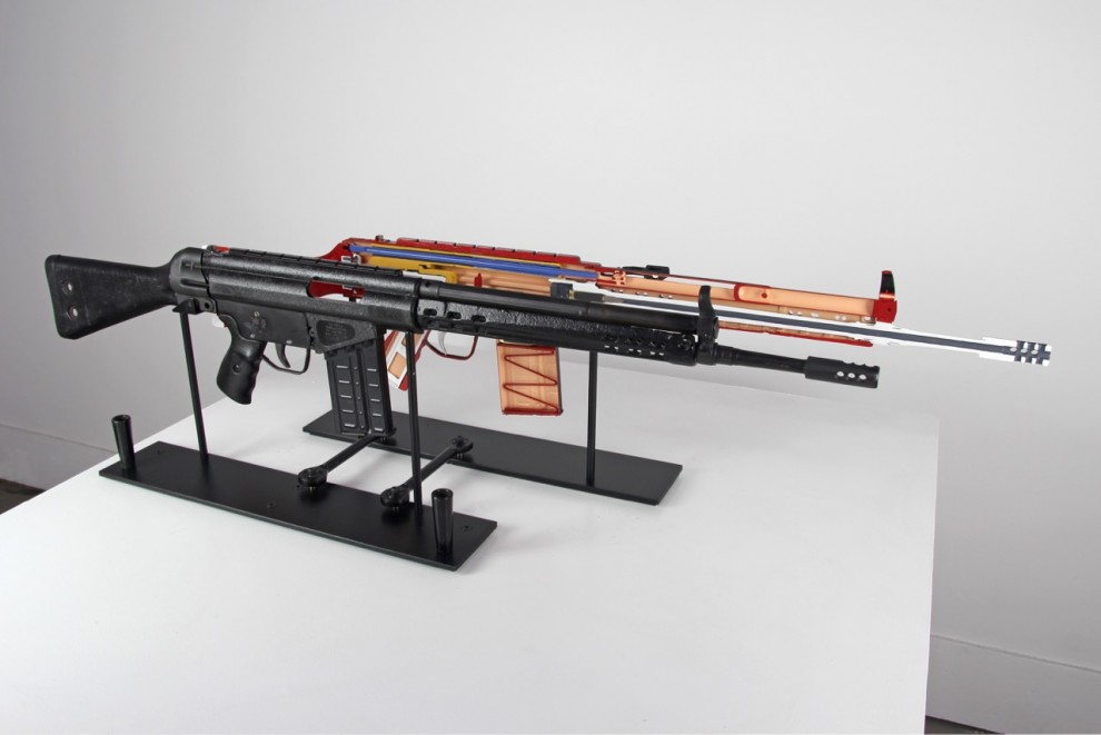 Kinetic Sculpture Featuring an Assault Rifle Cut in Half With the ...