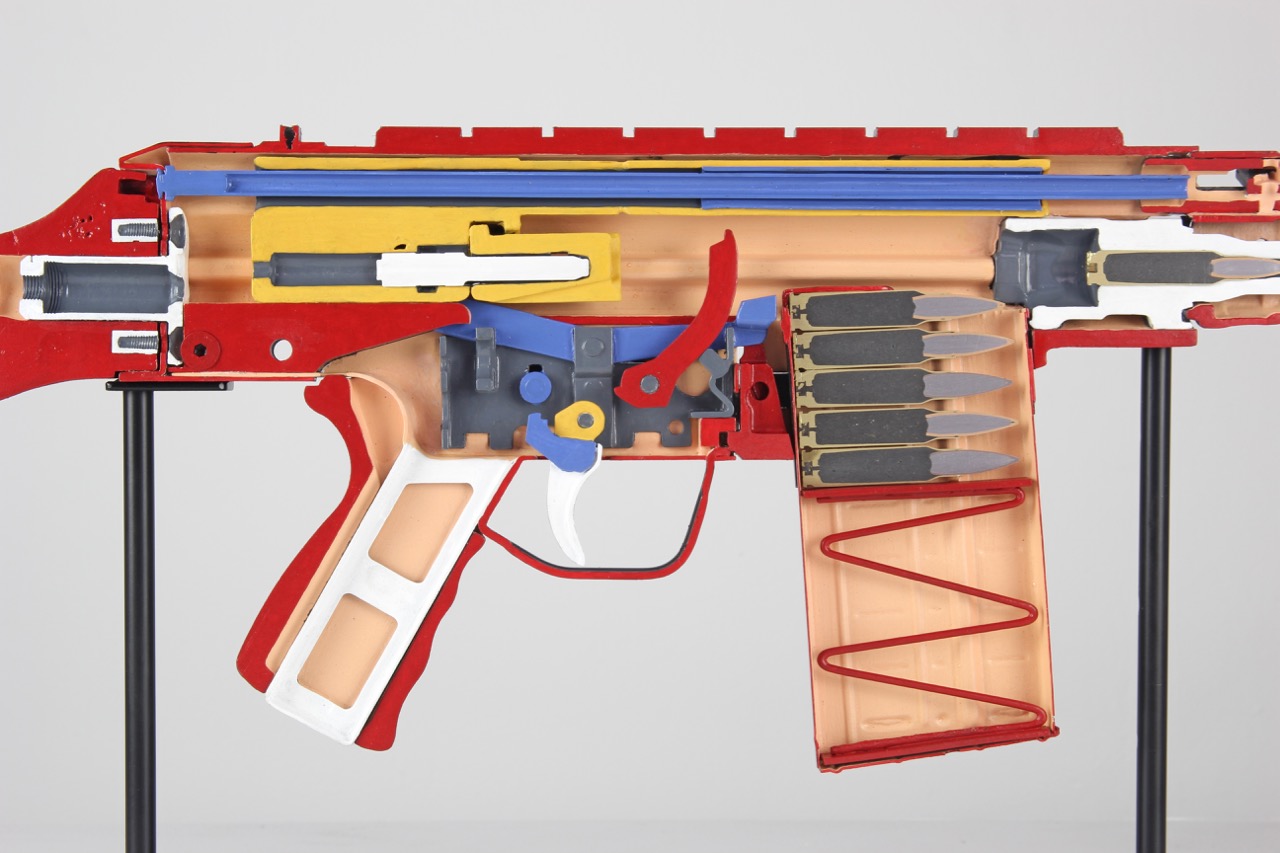 Kinetic Sculpture Featuring an Assault Rifle Cut in Half With the ...