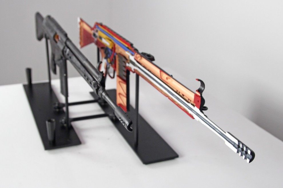 Kinetic Sculpture Featuring an Assault Rifle Cut in Half With the ...