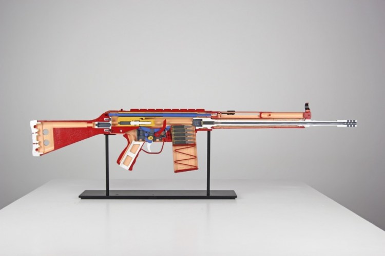 Kinetic Sculpture Featuring an Assault Rifle Cut in Half With the ...