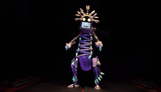 A Lively Glowing Bug Puppet Dances Upon Drum Pads That Provide Musical
