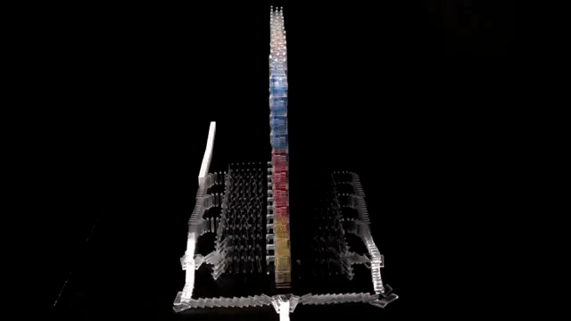 A Satisfying Demonstration of Vertically Arranged Domino Pyramids and ...