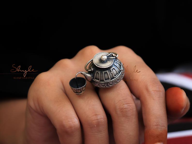 A Detailed Sterling Silver Chai Tea Kettle and Cup Ring