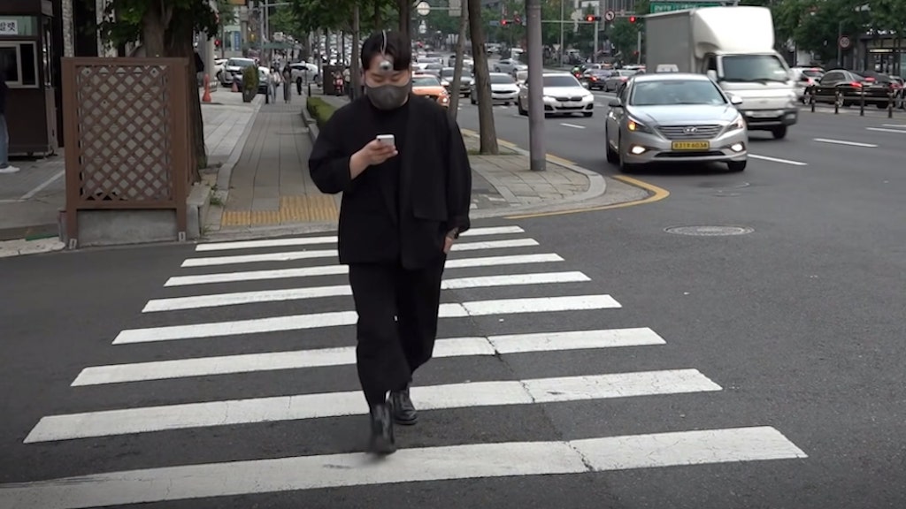 A Wearable Robotic Third Eye That Alerts People to Look Up From Their ...