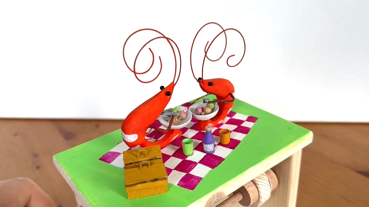 Wooden Shrimp Automata Prepare a Lovely Meal for a Picnic Date In the Park