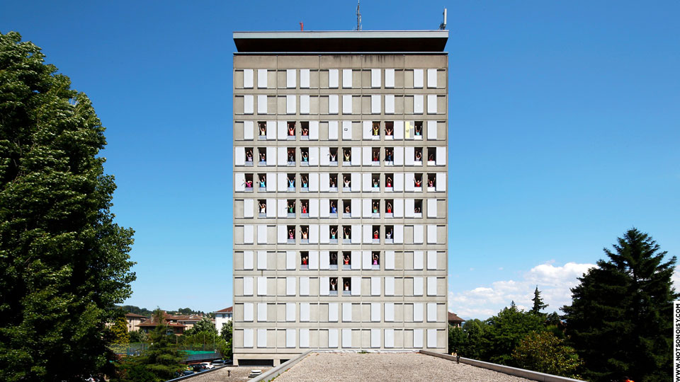 Animated Tower, A Building's Windows Form Pixels in a Giant Analog Display